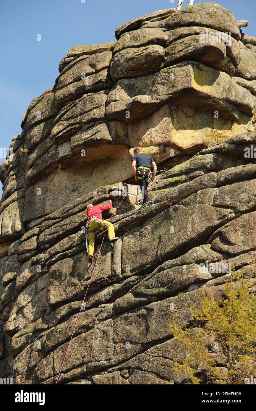 Schierke, Germany. 09th May, 2021. People climbing on the Schierker Feuerstein. The climbers ...