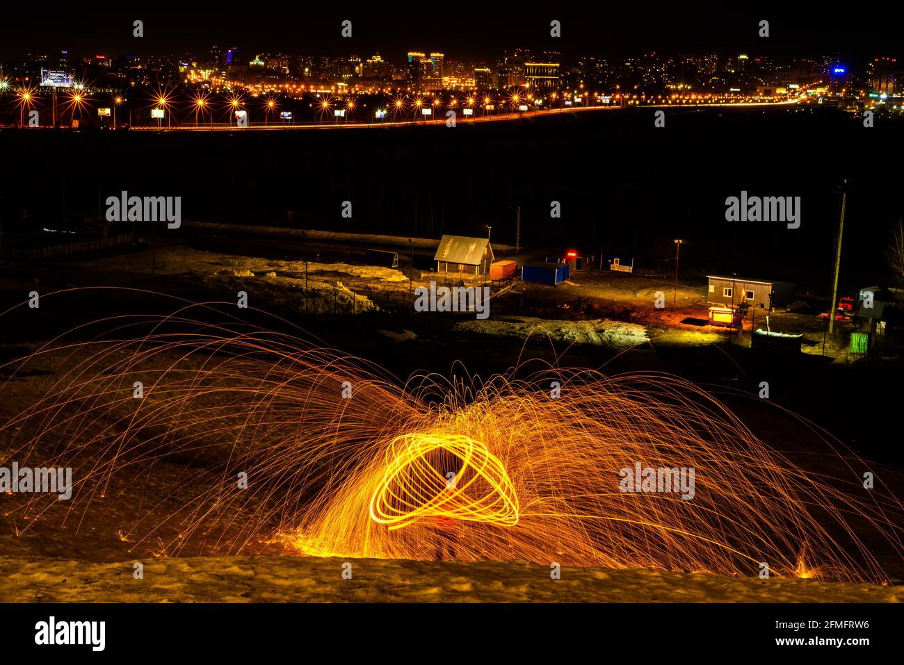 Large round burning fireworks sparkle from the burning steel wool. The ...
