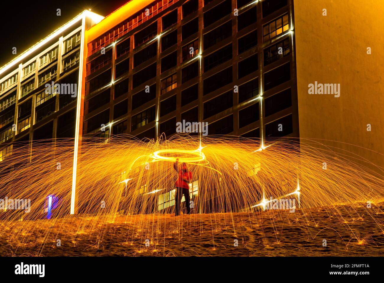 Large round burning fireworks sparkle from the burning steel wool. The ...