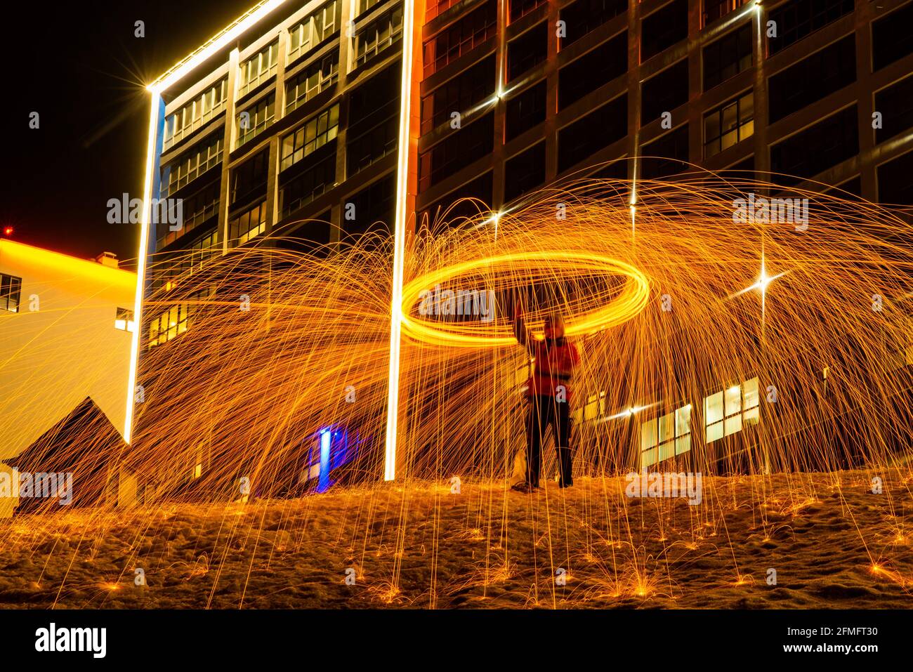 Large round burning fireworks sparkle from the burning steel wool. The ...