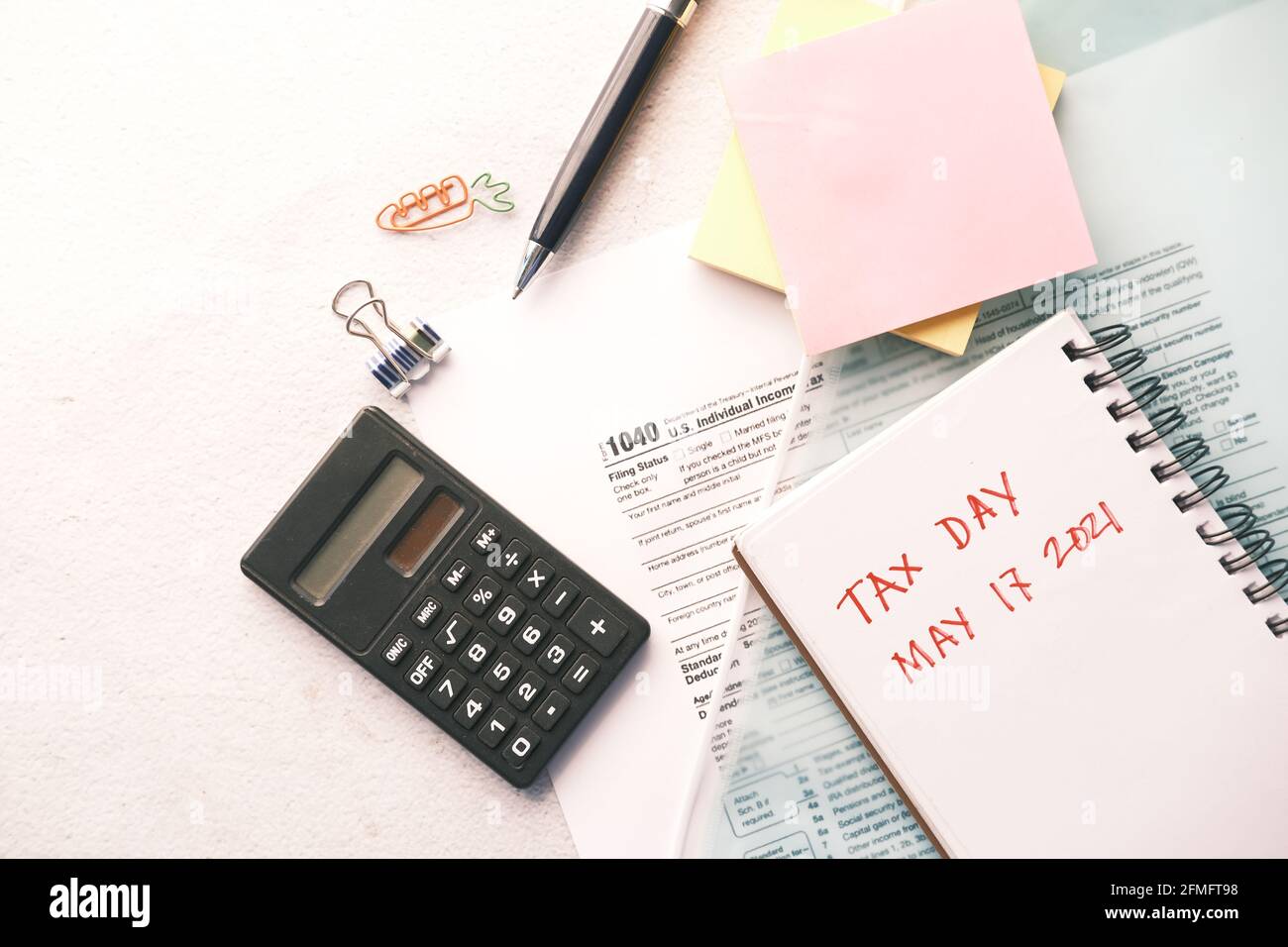 Tax return form and hand written return date on notepad Stock Photo - Alamy