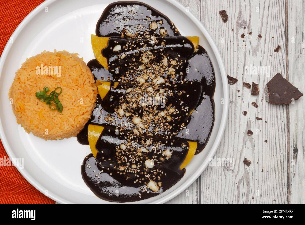 A top view of delicious Mexican mole chicken enchiladas with red rice ...
