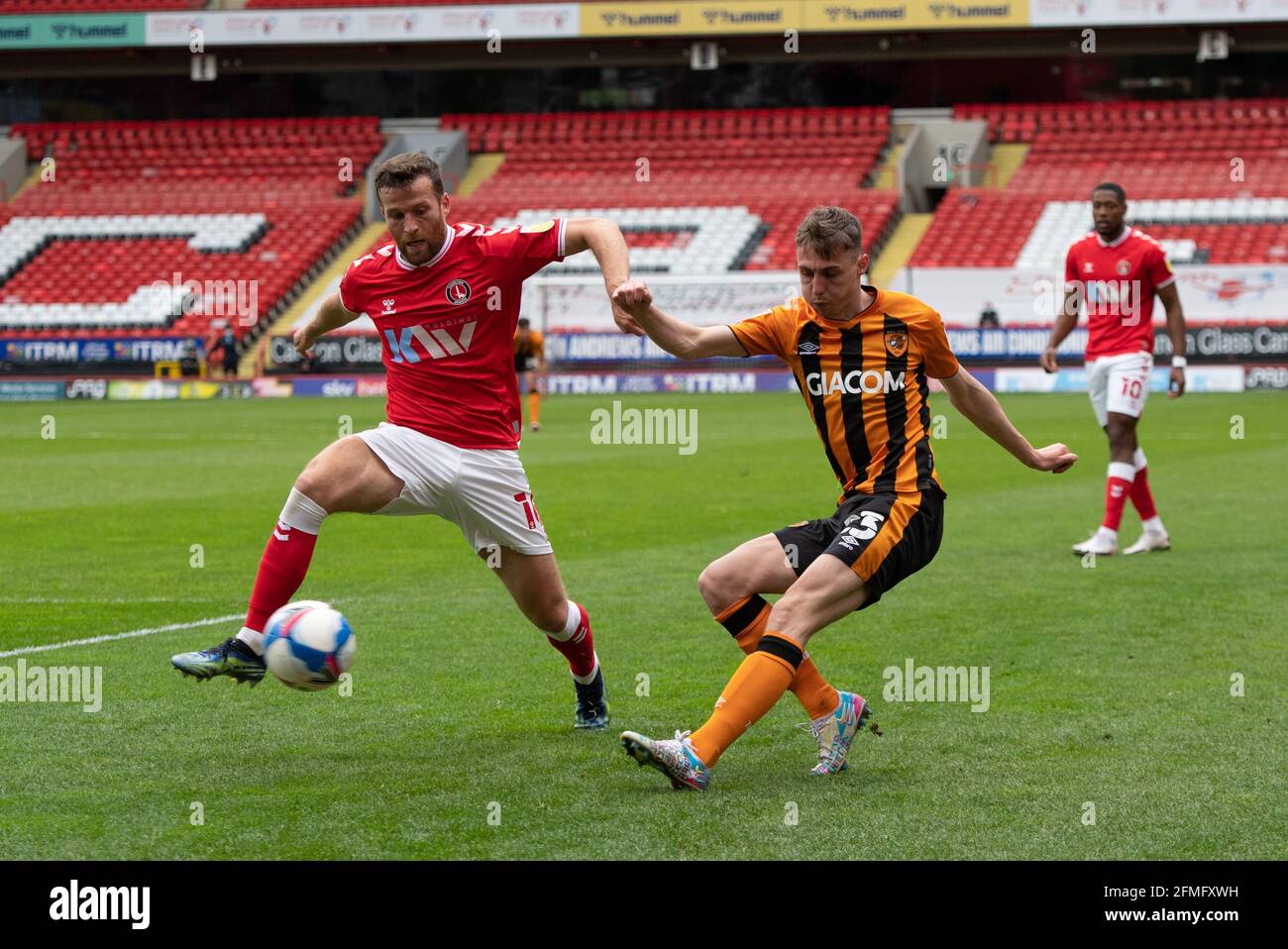 London, UK. 09th May, 2021. Gavin Whyte of Hull City and Adam Matthews ...
