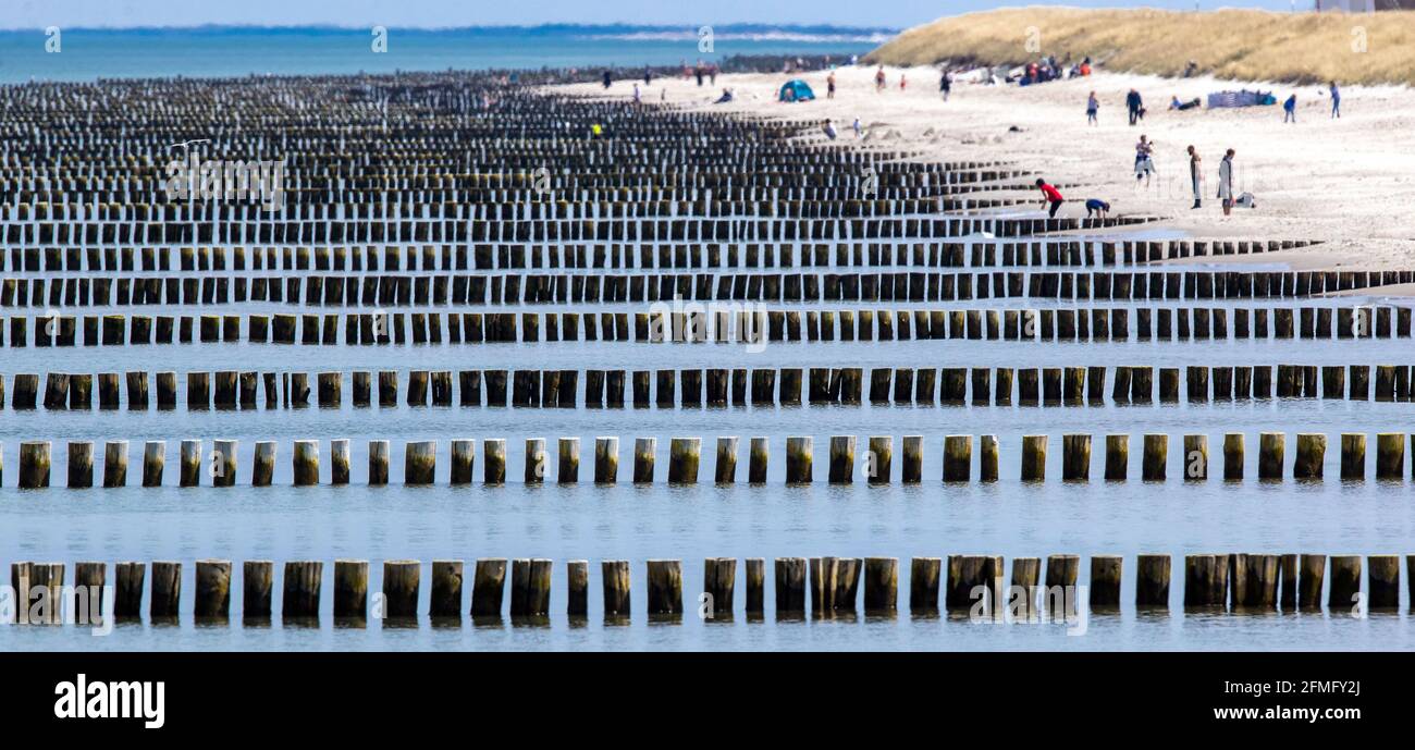 Zingst, Germany. 09th May, 2021. Walkers are on the beach on the Darss ...