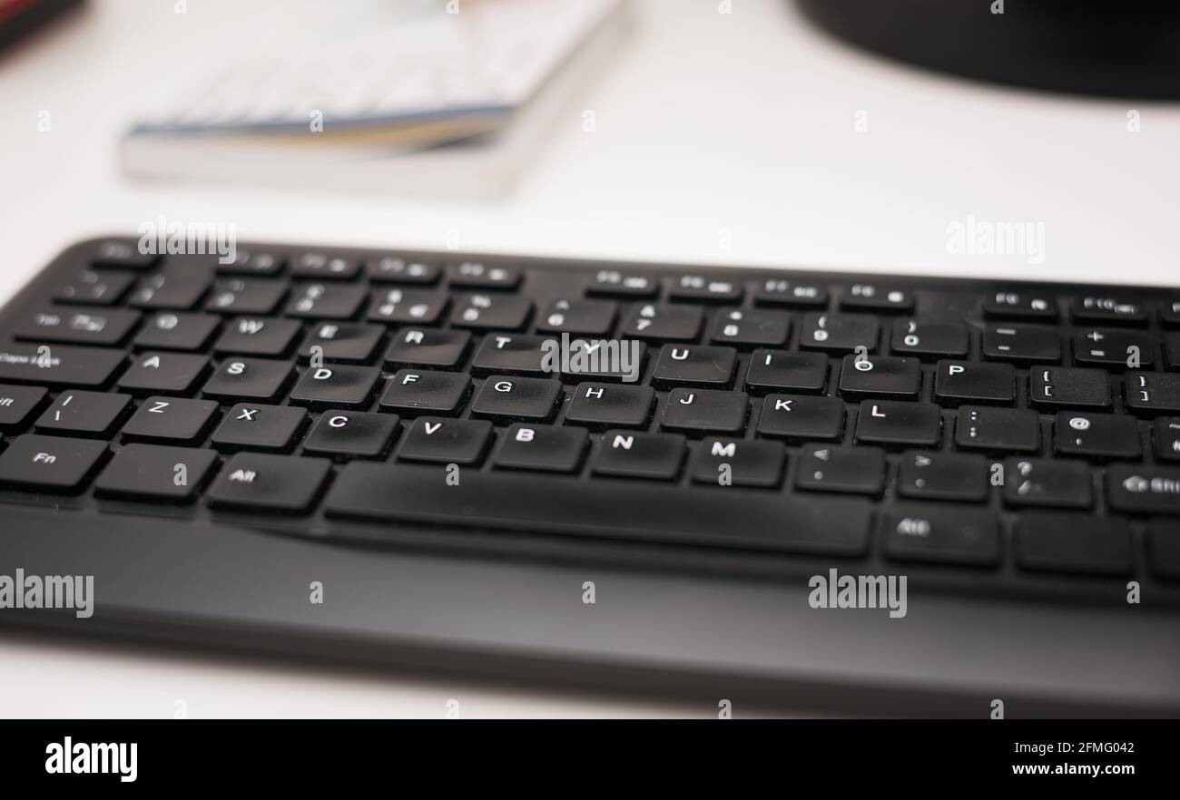 Computer keyboard isolated on desk in the office Stock Photo - Alamy