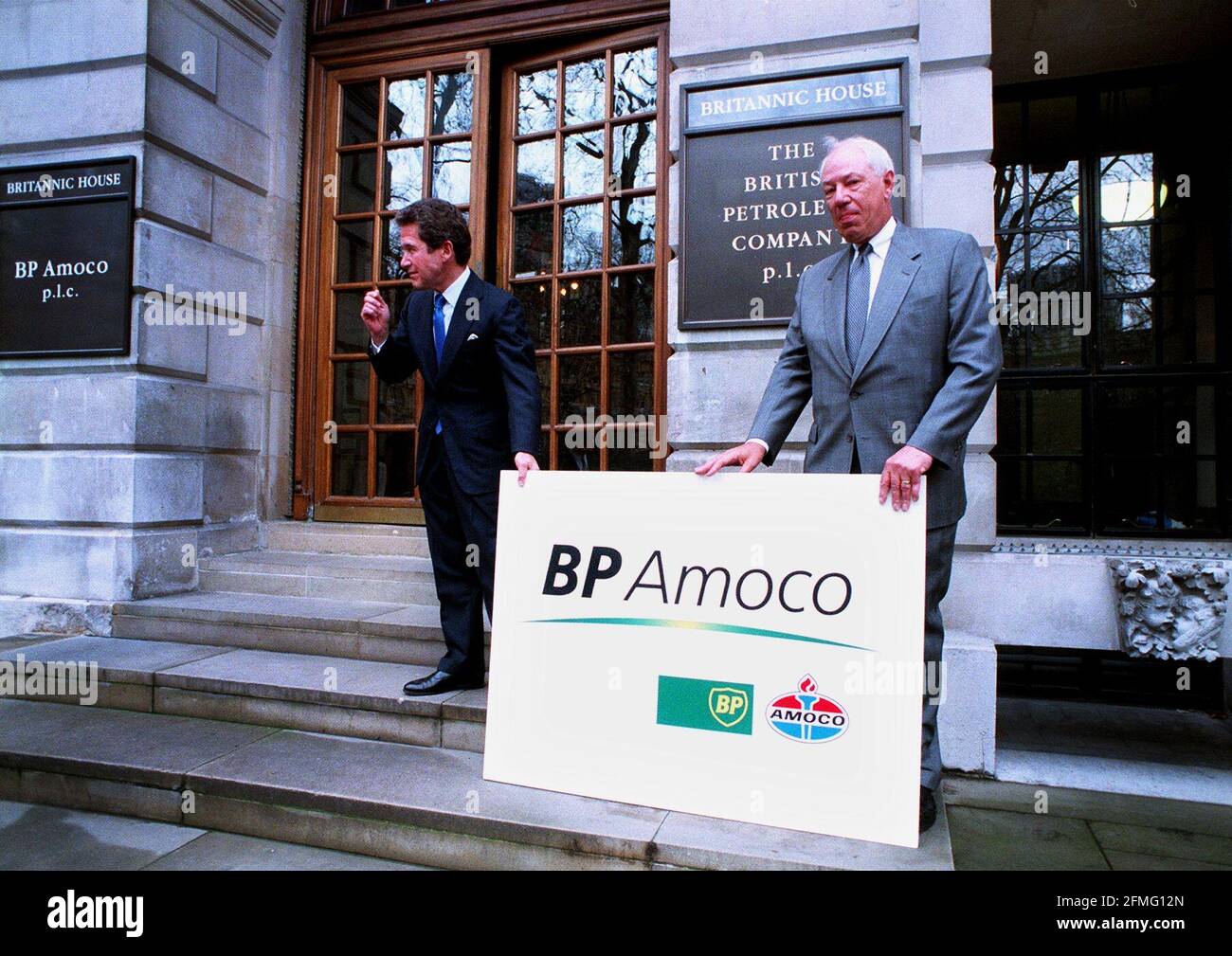 Sir John Browne (L) Chief Executive of BP/Amoco January 1999 with Larry ...