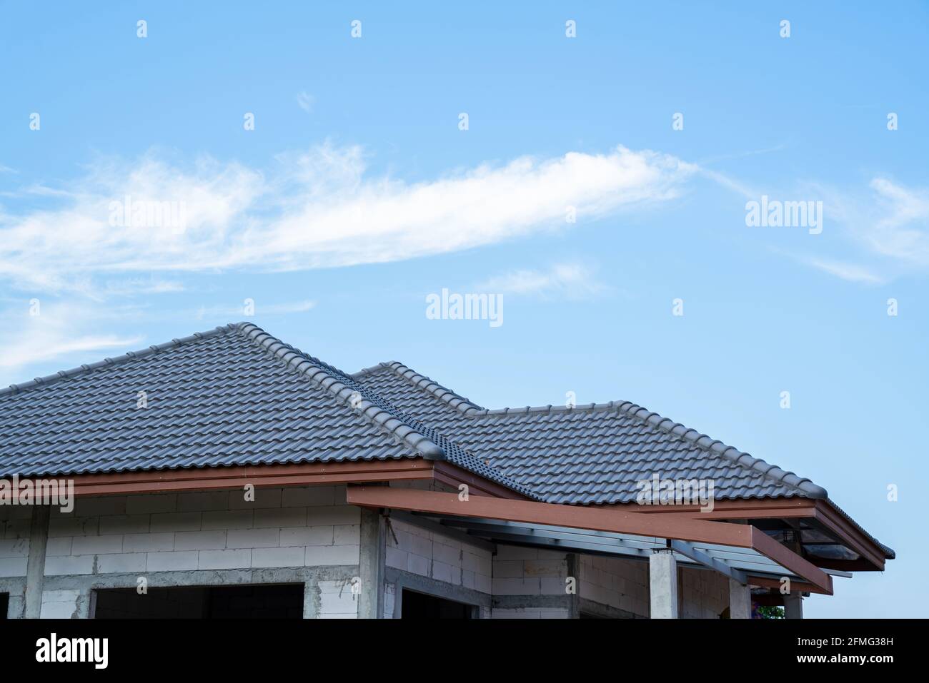 New tile roof of home with spanish tiled roof at unfinished house ...