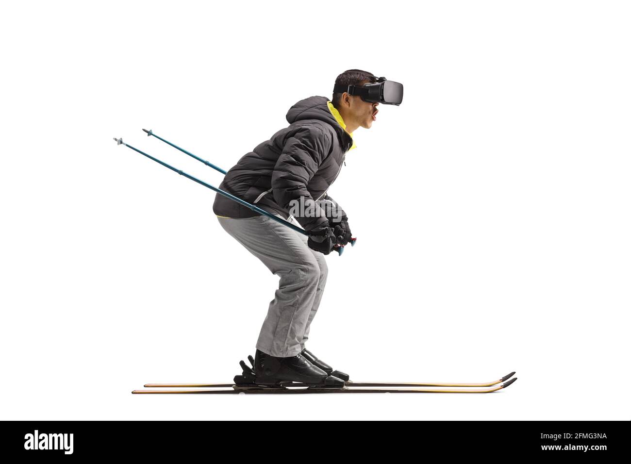 Full length profile shot of a man skiing with VR headset isolated on ...