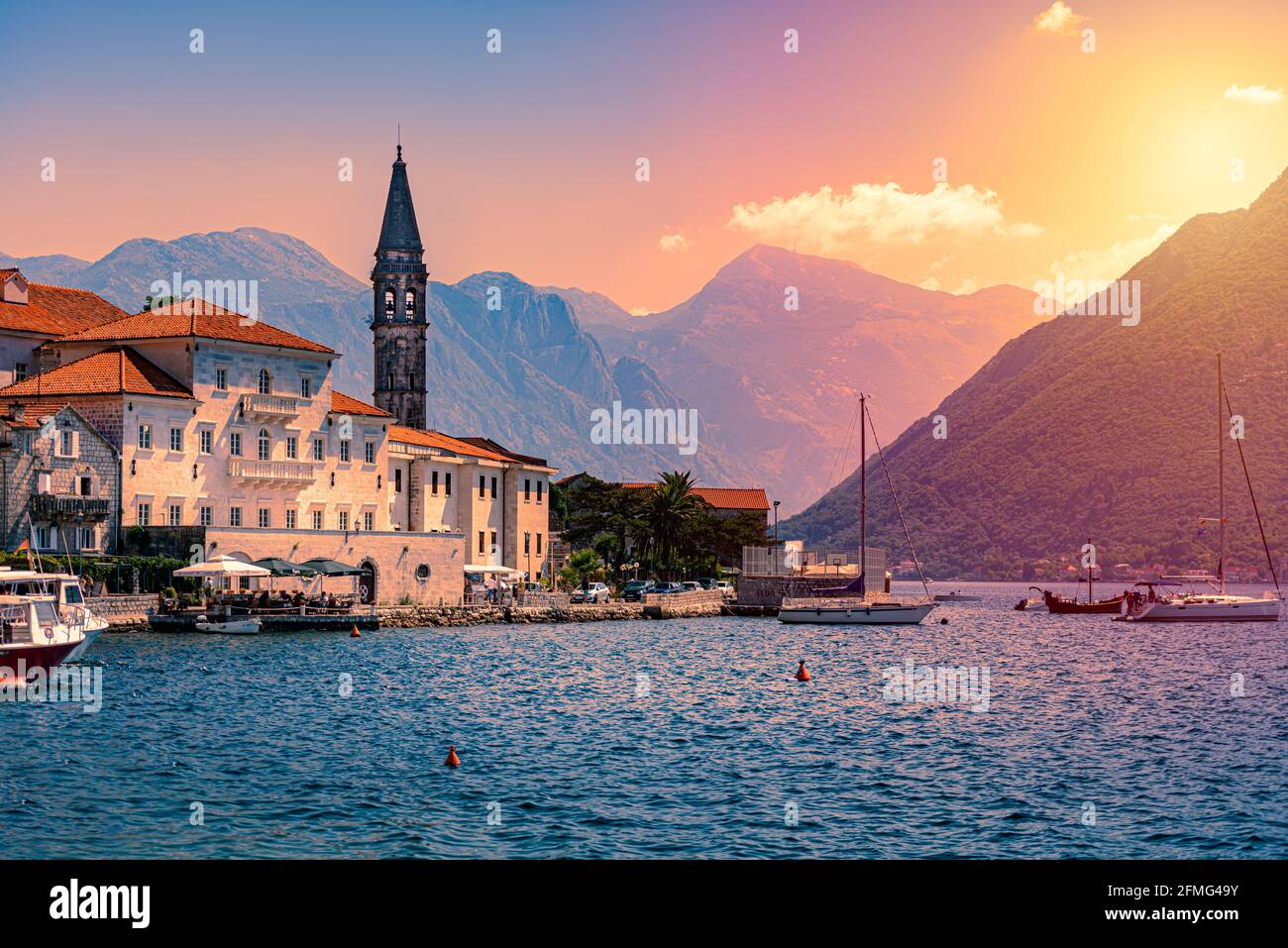 Perast bay, city and mountain views, Montenegro. Sunset scene with ...
