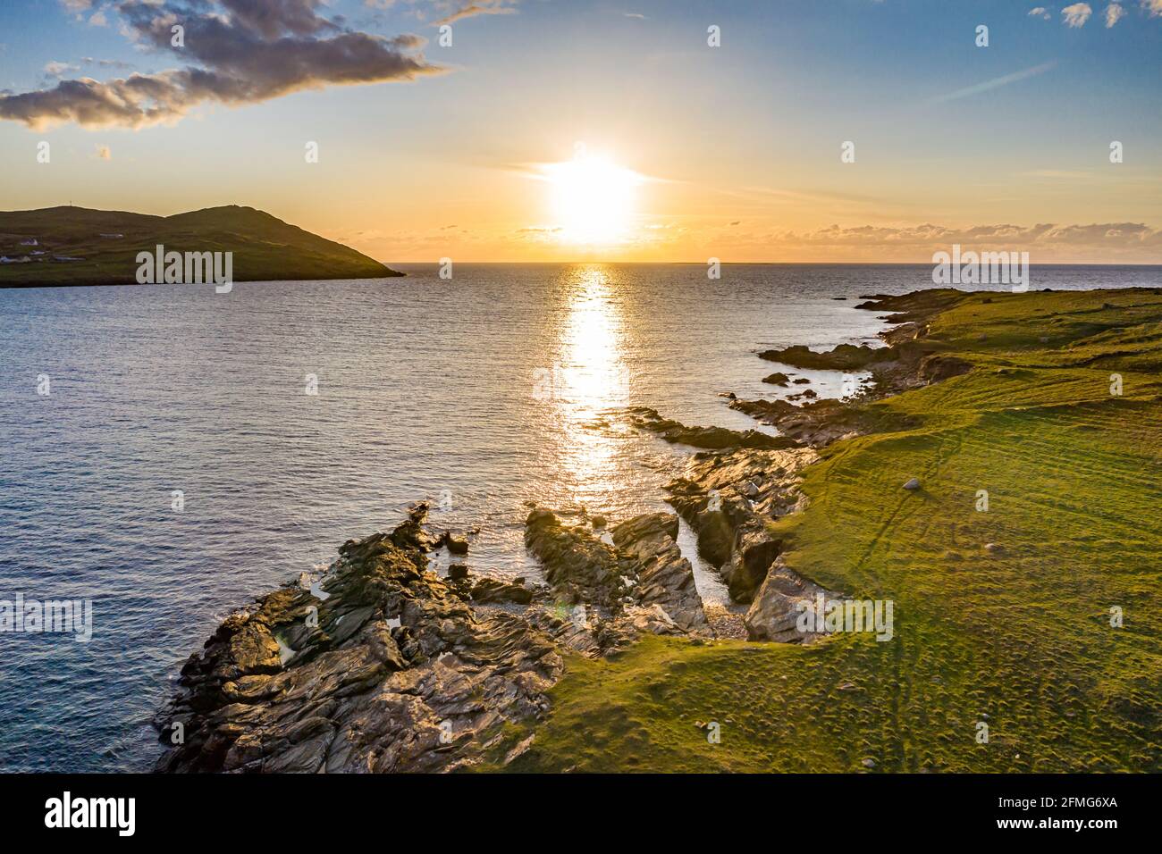 Sunset seen from Inishkeel Island by Portnoo harbour in County Donegal ...