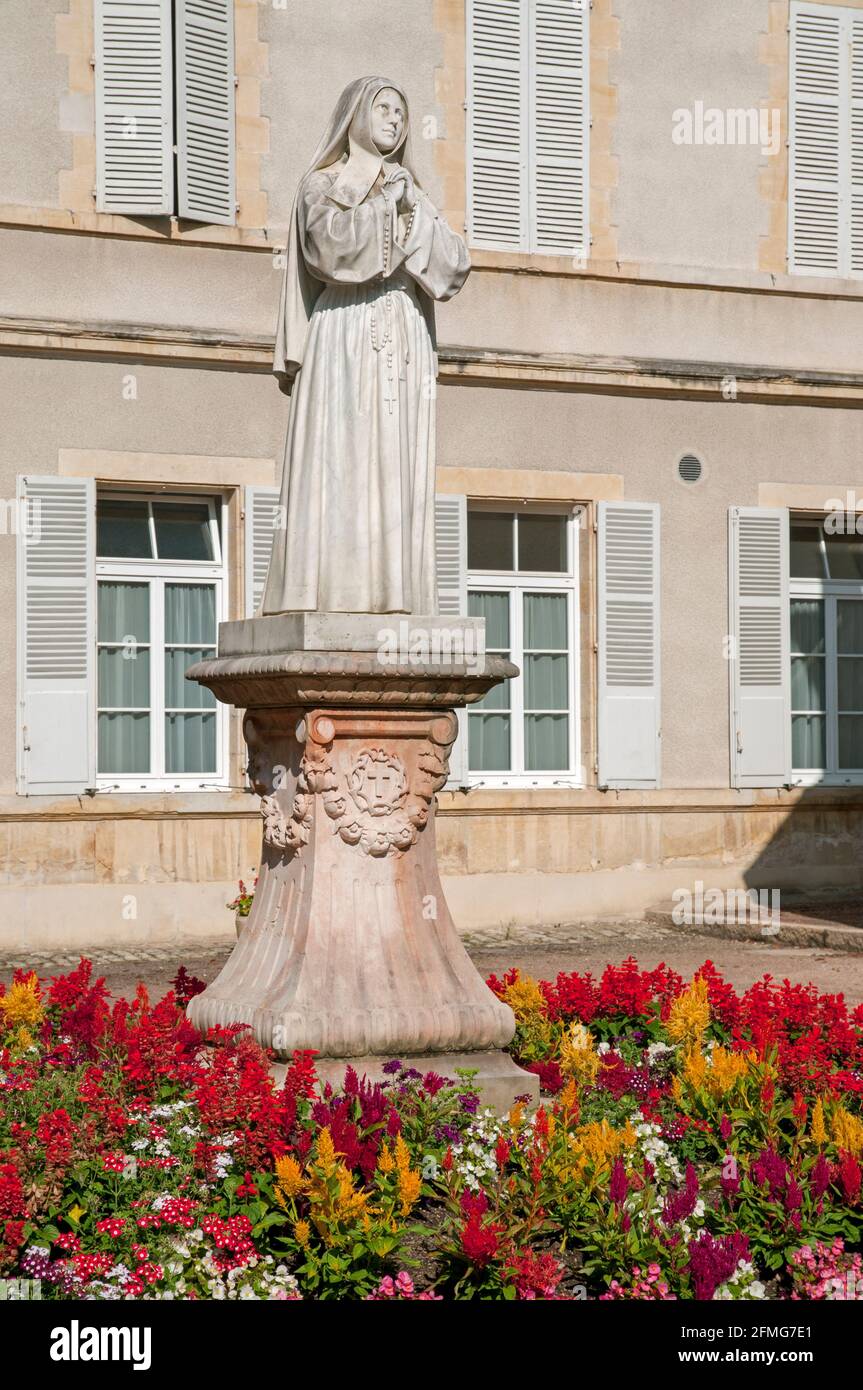 Statue of Saint Bernadette Soubirous praying in Saint Gildard sanctuary ...