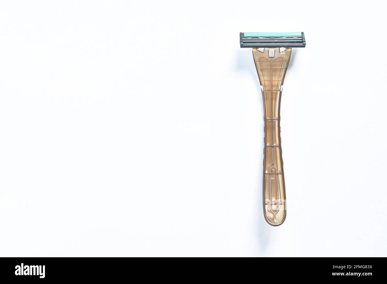 green plastic shaver arranging on white background Stock Photo - Alamy