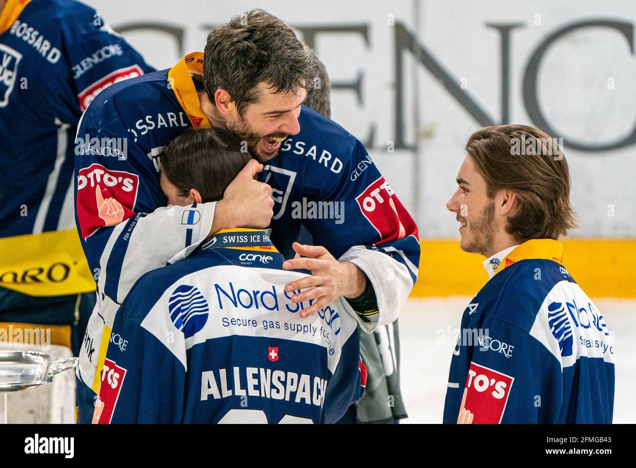 Raphael Diaz # 16 (EV Zug) hugs Dario Allenspach # 96 (EV Zug) during ...