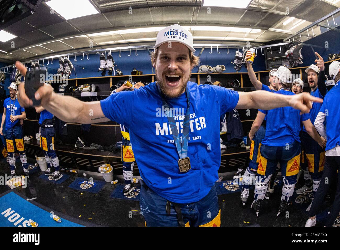 Claudio Cadonau # 34 (EV Zug) cheers in the cabin during the National ...