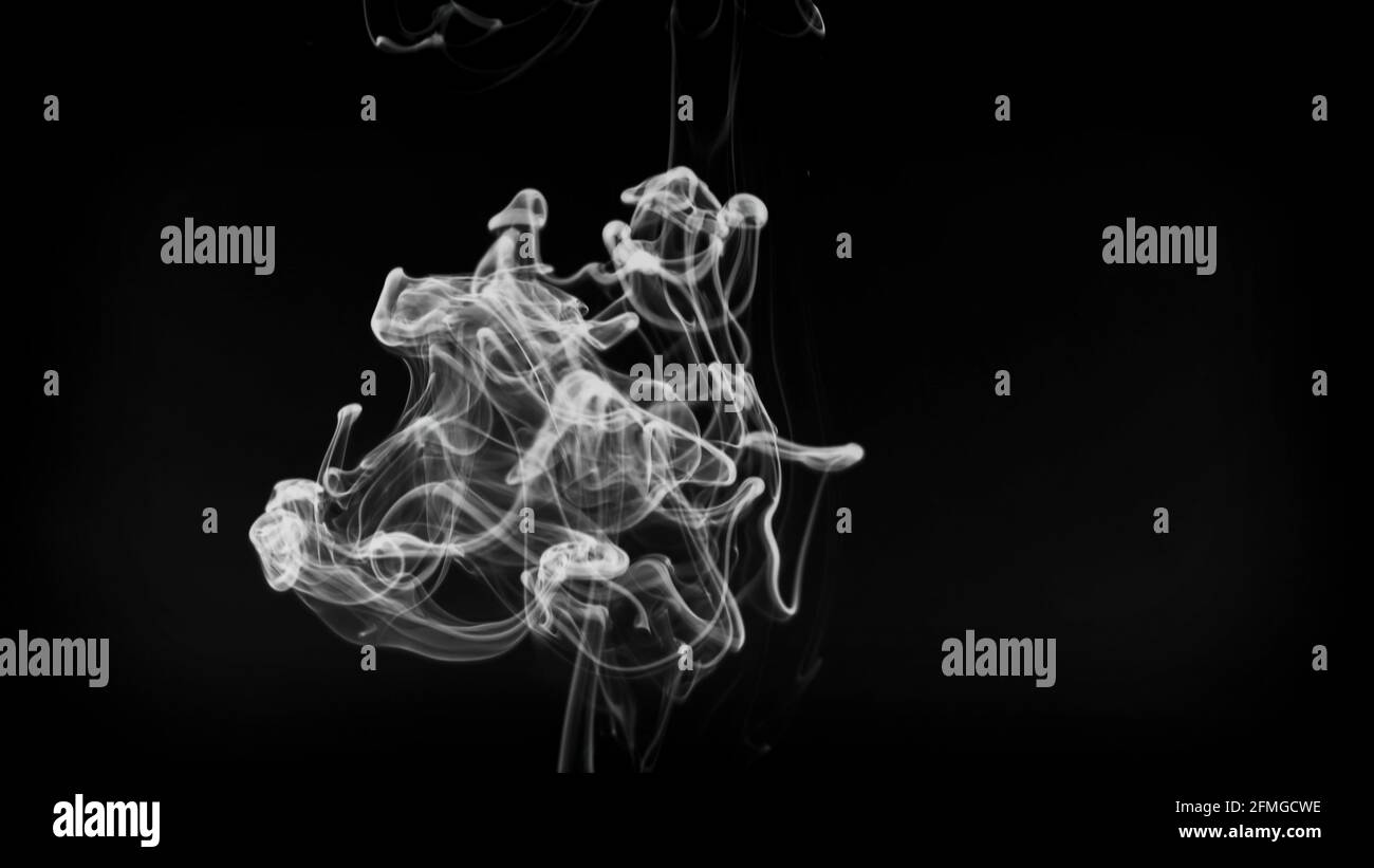 Shooting of smoky clouds dissolving in water Stock Photo - Alamy