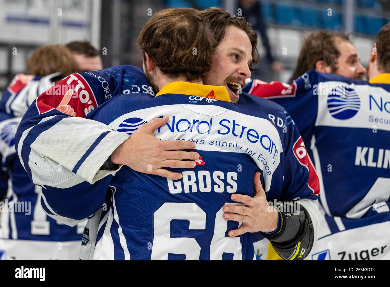 Claudio Cadonau # 34 (EV Zug) celebrates with Nico Gross # 66 (EV Zug ...