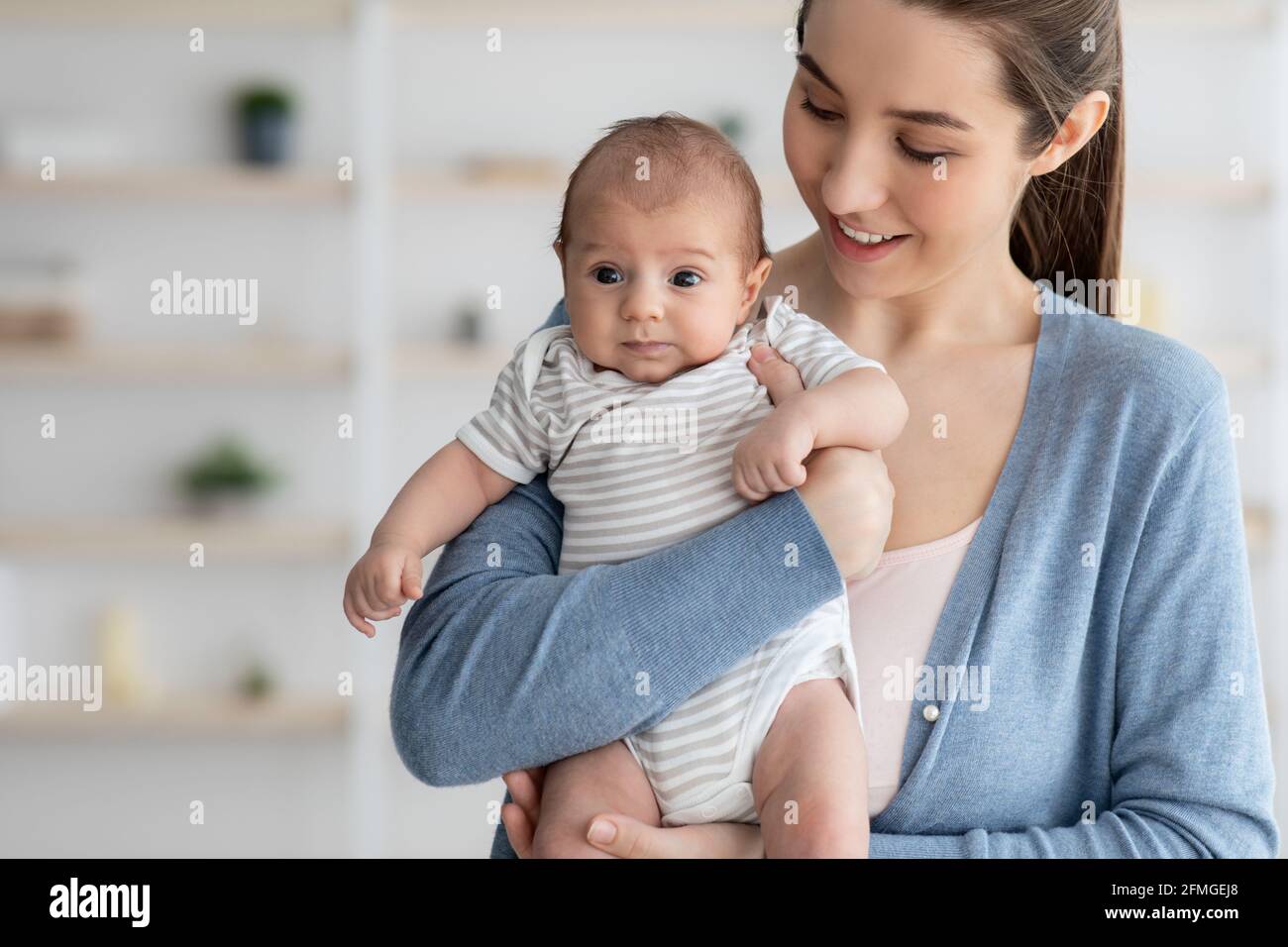 Portrait Of Cute Adorable Newborn Baby In Mother's Hands Stock Photo ...