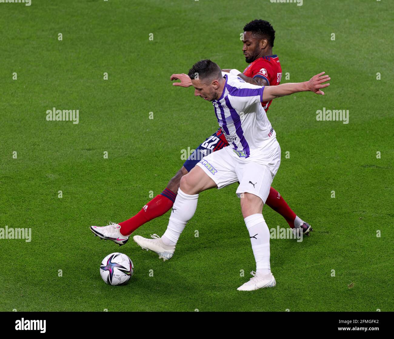 BUDAPEST, HUNGARY - MAY 3: (r-l) Stopira of MOL Fehervar FC challenges ...