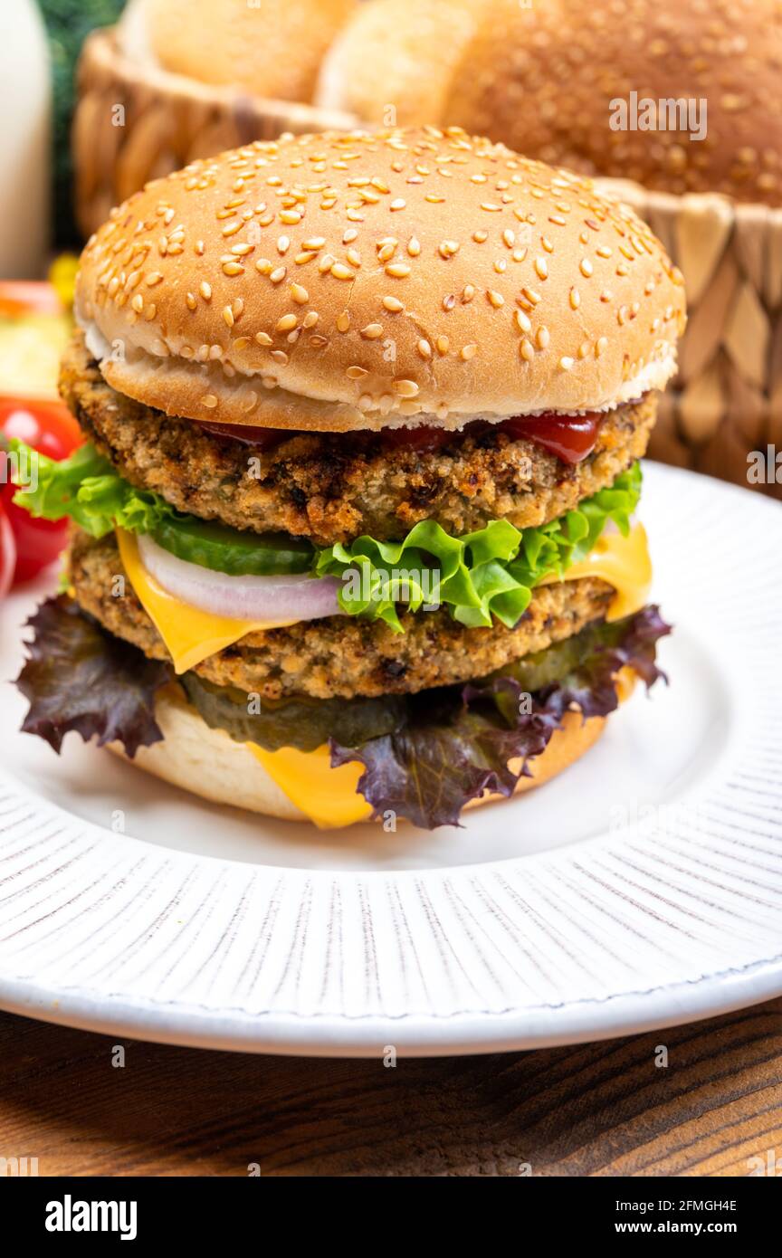Tasty vegetarian cheeseburgers with round patties or burgers made from ...
