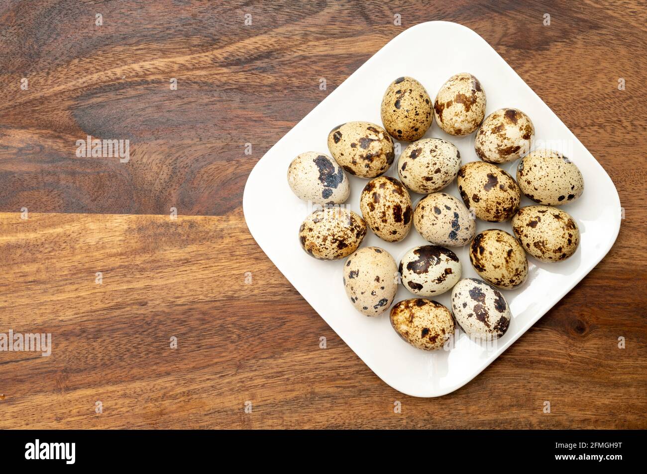 Fresh small spotted partridge eggs on white board close up Stock Photo ...