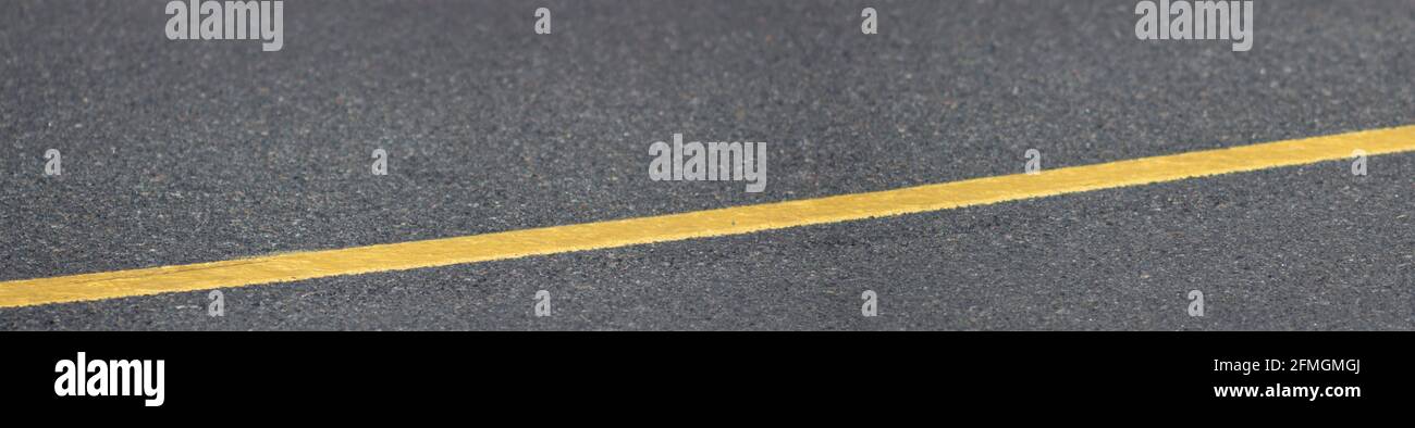 Panorama of asphalt texture with a long yellow line Stock Photo - Alamy
