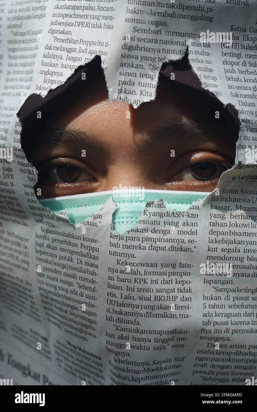 Woman wearing a ripped face mask hi-res stock photography and images ...