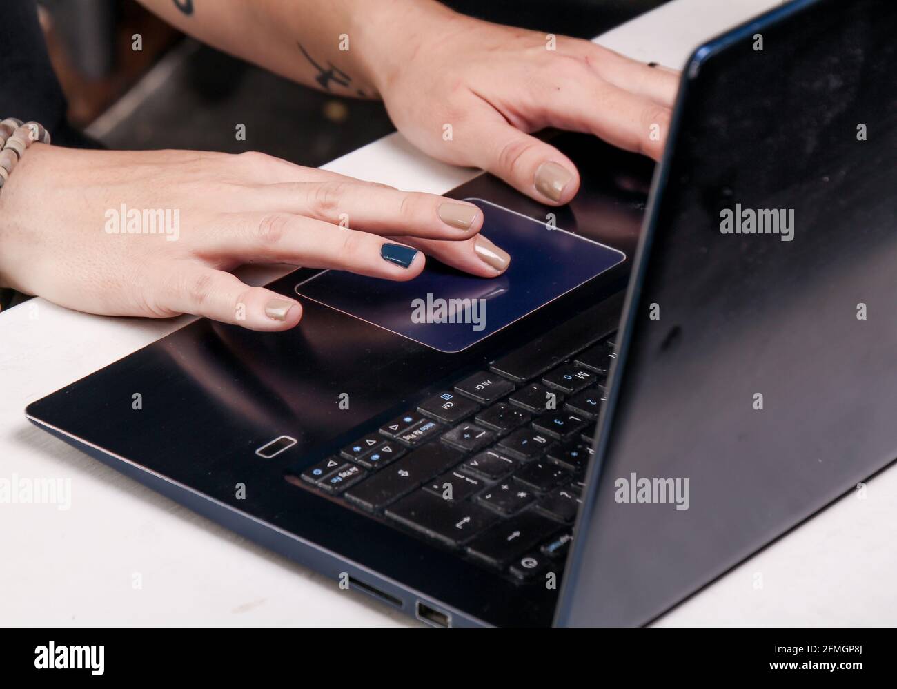 A closeup shot of female hands typing on a laptop keyboard Stock Photo ...