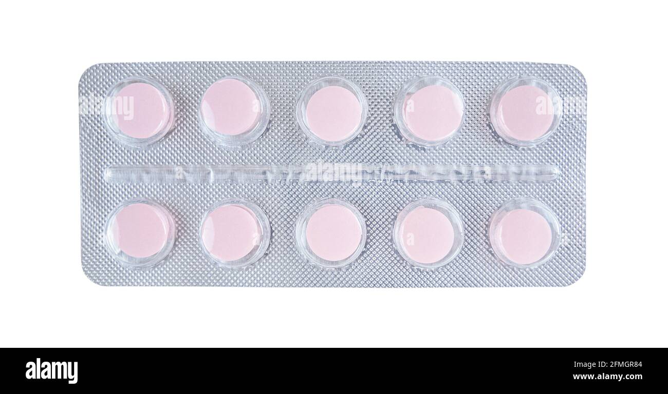 Pink tablets in blister isolated on white background Stock Photo - Alamy