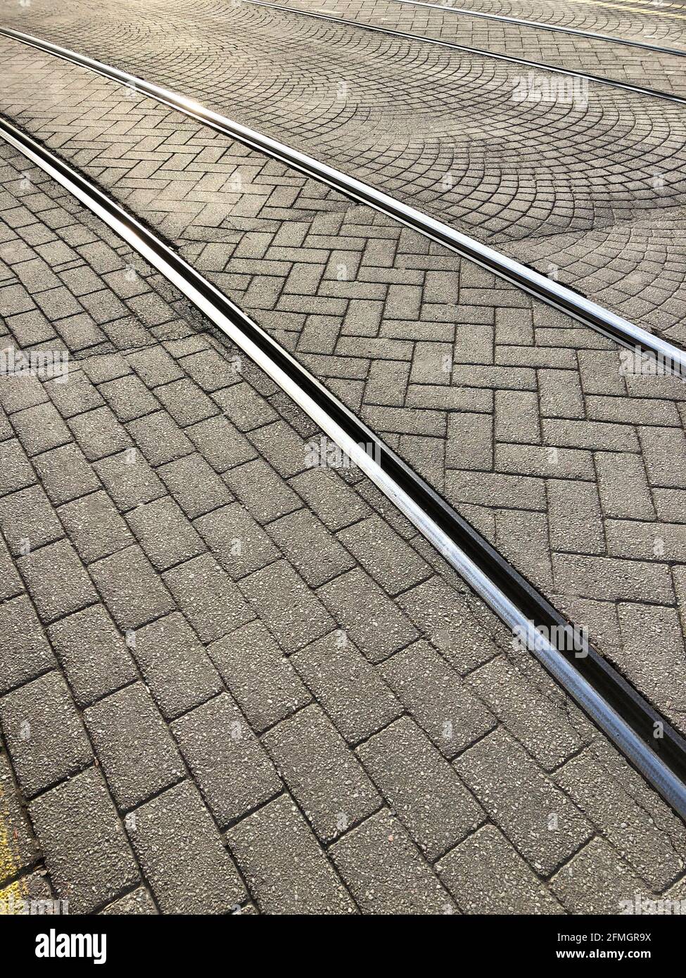 Train tracks on the street Stock Photo - Alamy