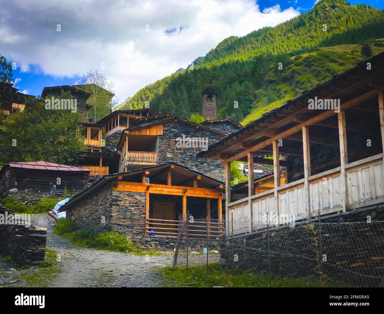 Panoramic view river and unique Dartlo village stone rebuilt buildings ...