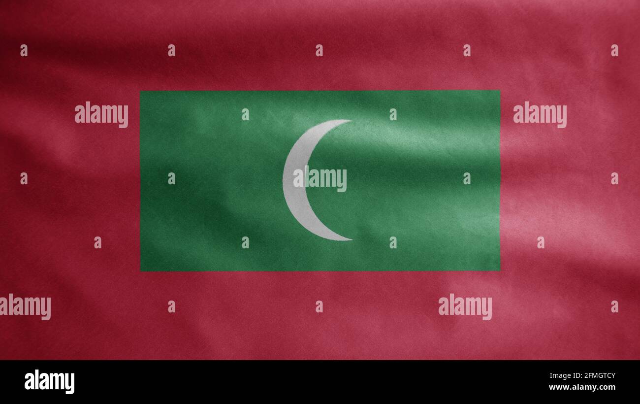 Maldivian flag waving in the wind. Close up of Maldives banner blowing ...
