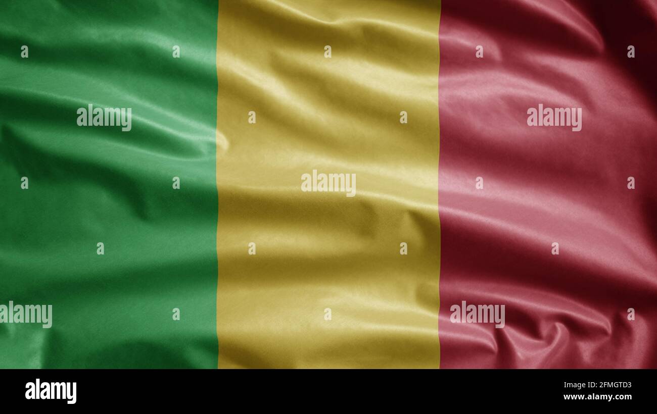 Malian flag waving in the wind. Close up of Mali banner blowing, soft ...