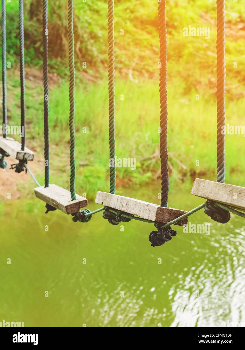 Swings over water hi-res stock photography and images - Alamy