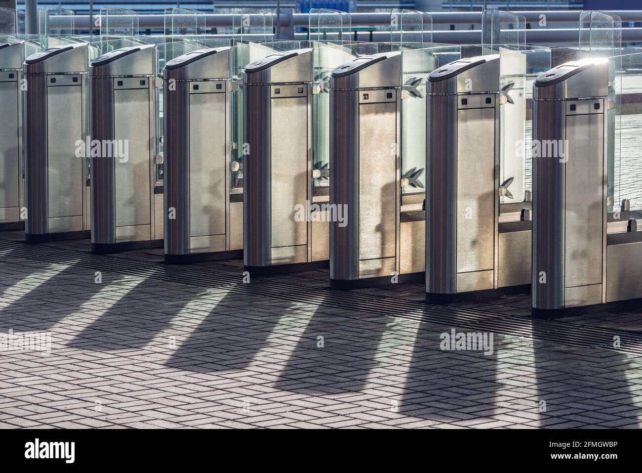 Turnstiles with electronic card readers on the station platform Stock ...
