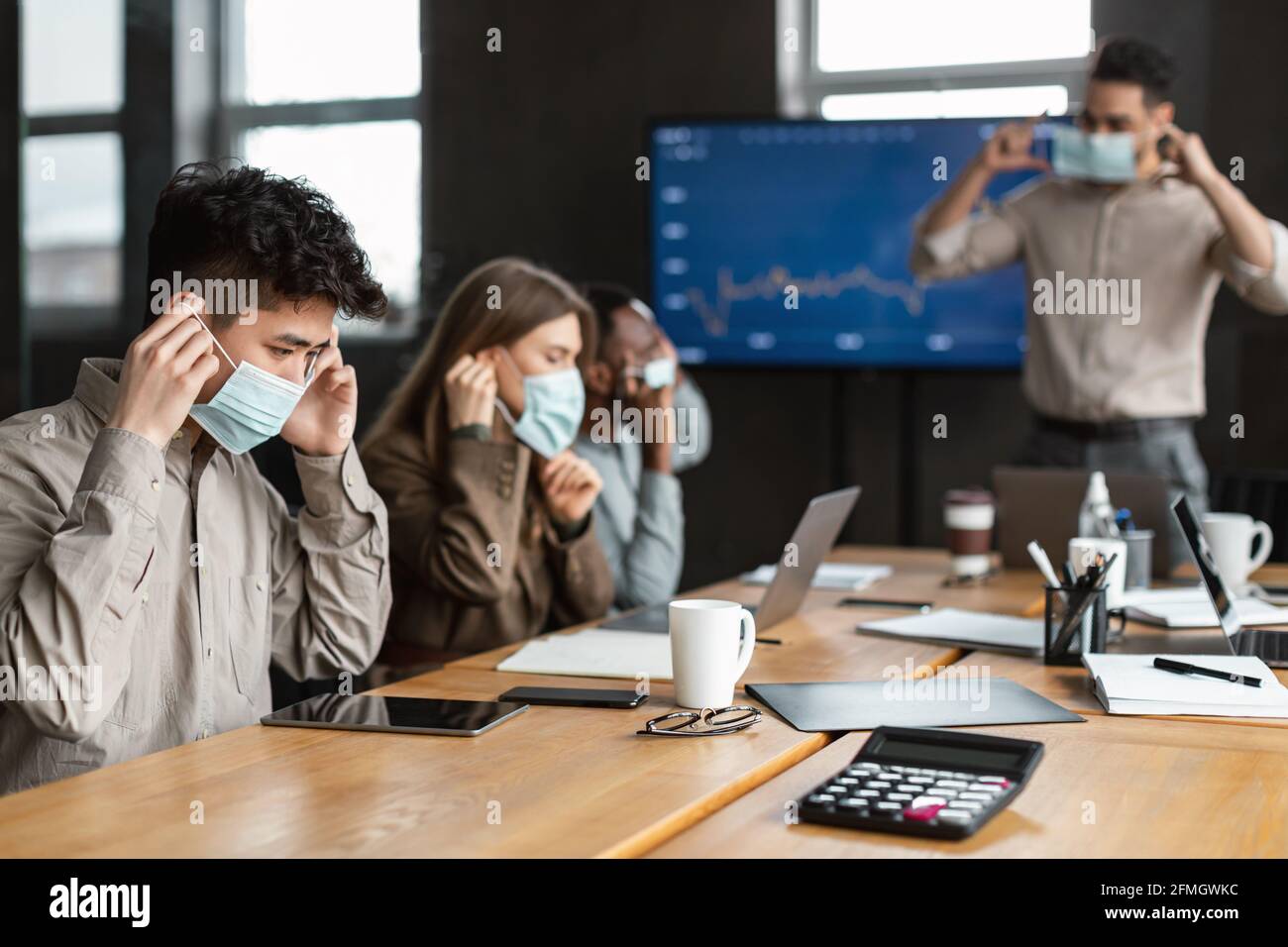 International people wearing medical masks at work Stock Photo - Alamy