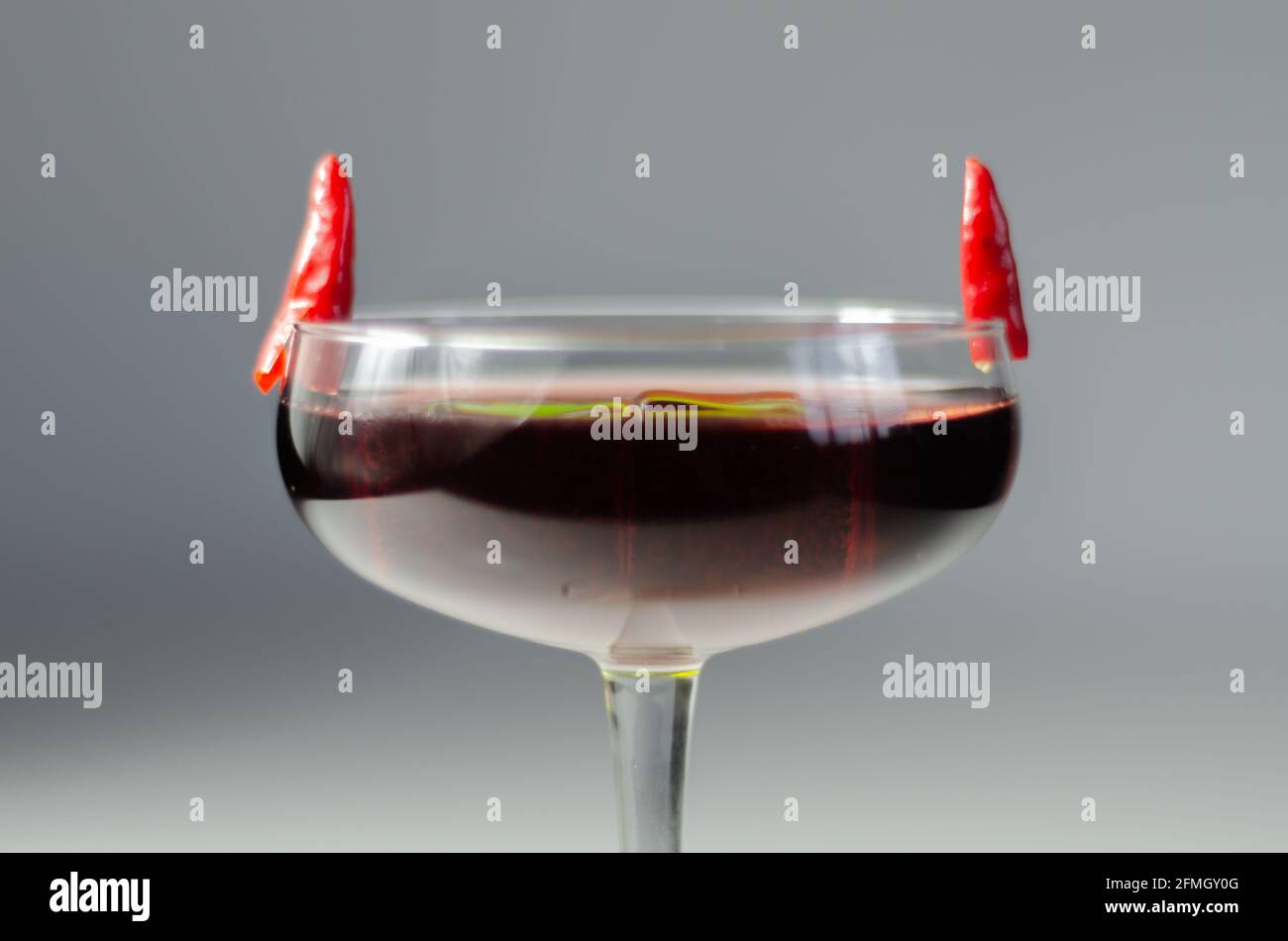 Cocktail drink prepared with vodka, grenadine and lemon juice decorated ...