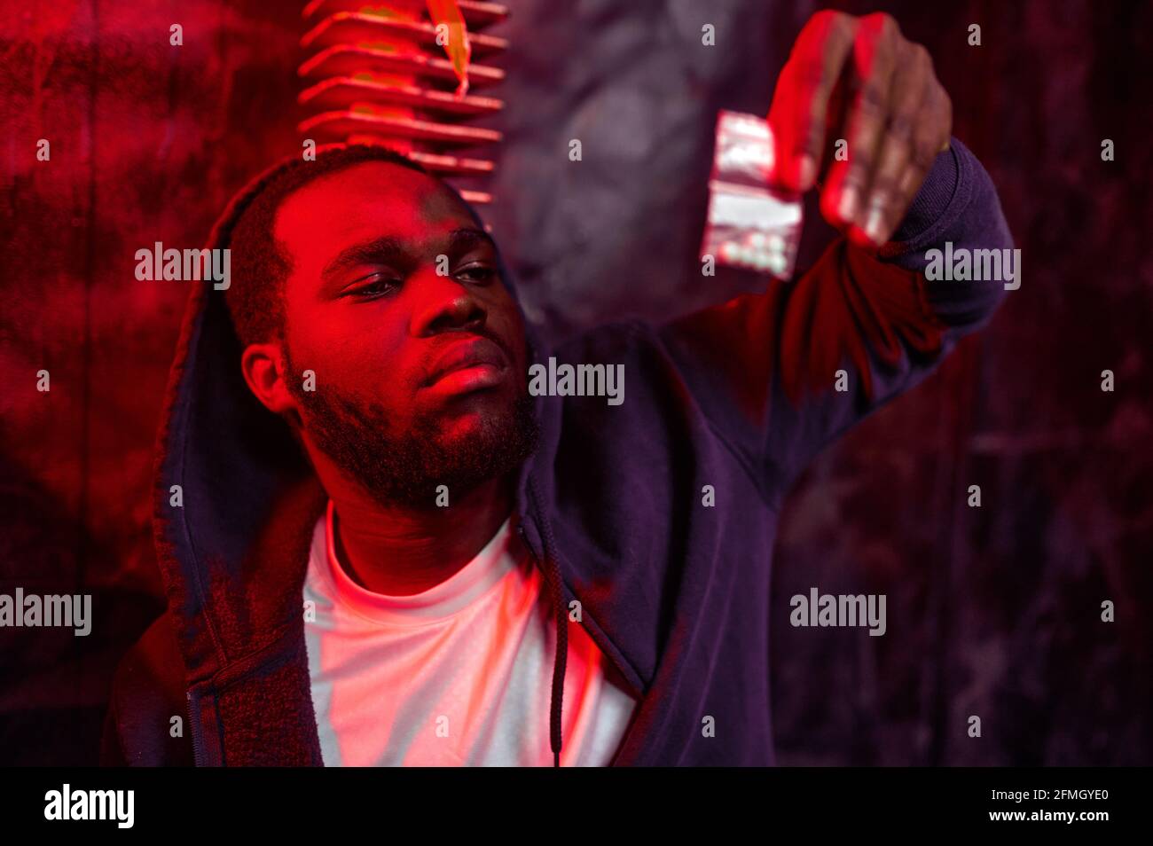 Drug addict man with package of pills Stock Photo - Alamy