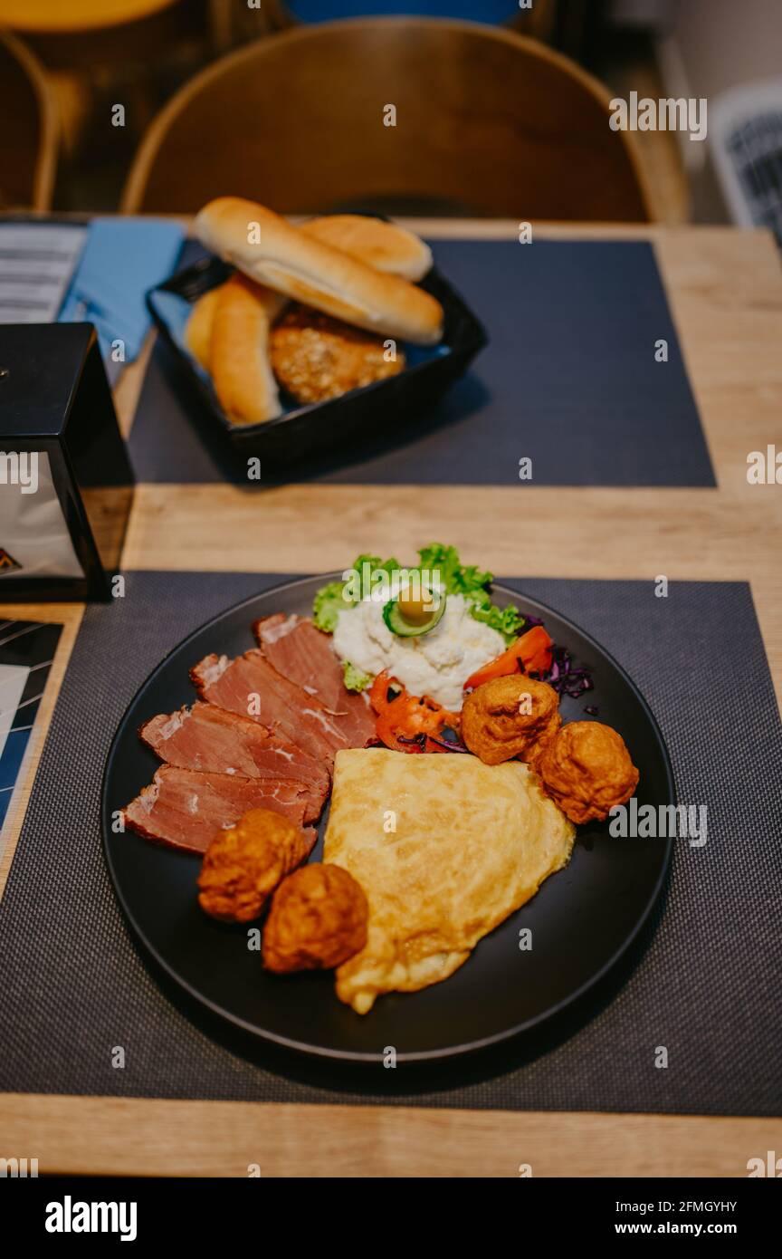 A vertical shot of deliciously prepared breakfast in a cafe Stock Photo ...