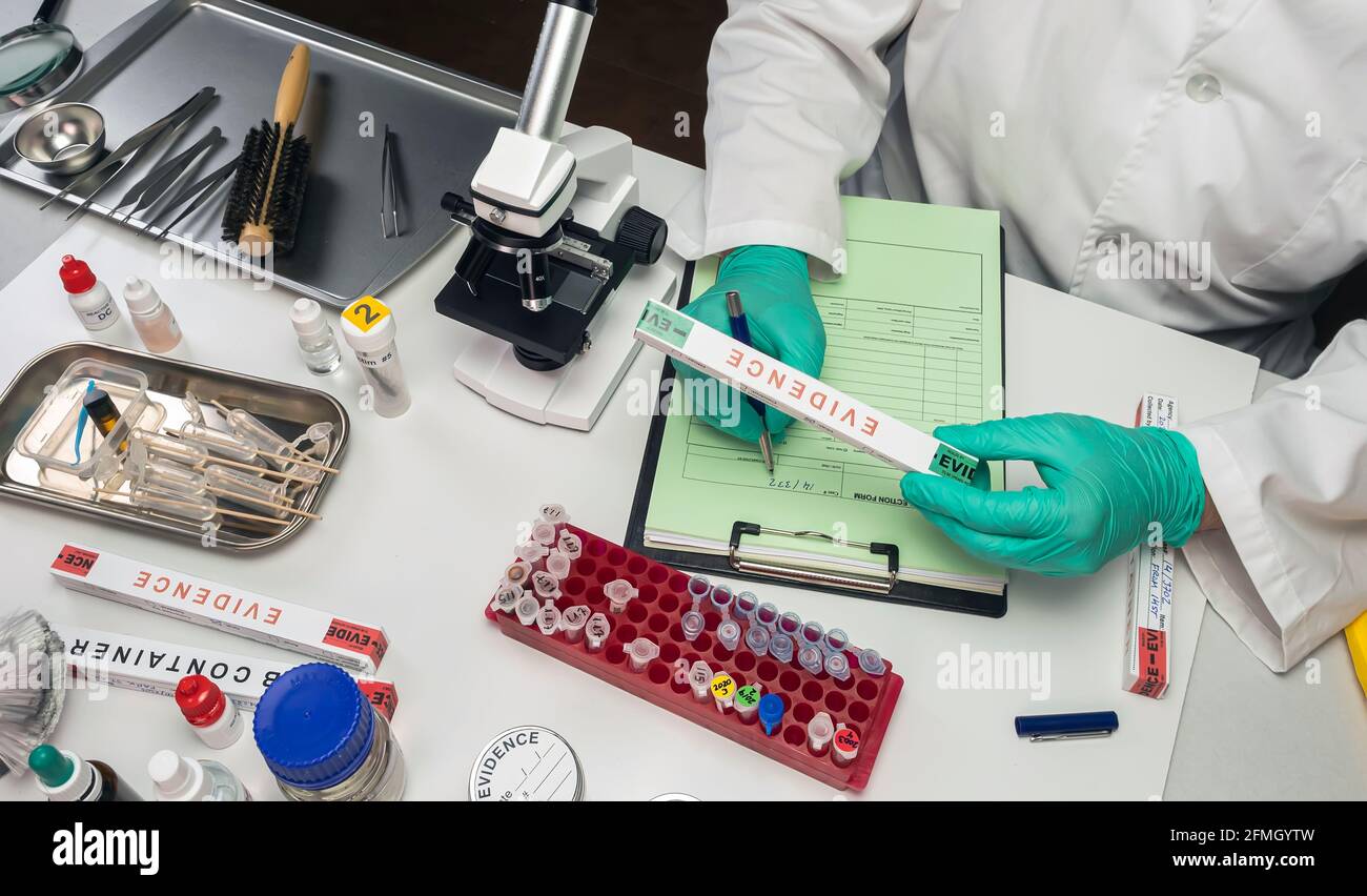 police scientist takes data from evidence box in crime lab, conceptual ...