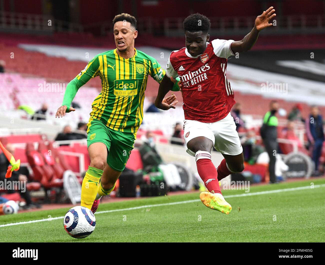 West Bromwich Albion's Callum Robinson (left) and Arsenal's Bukayo Saka ...