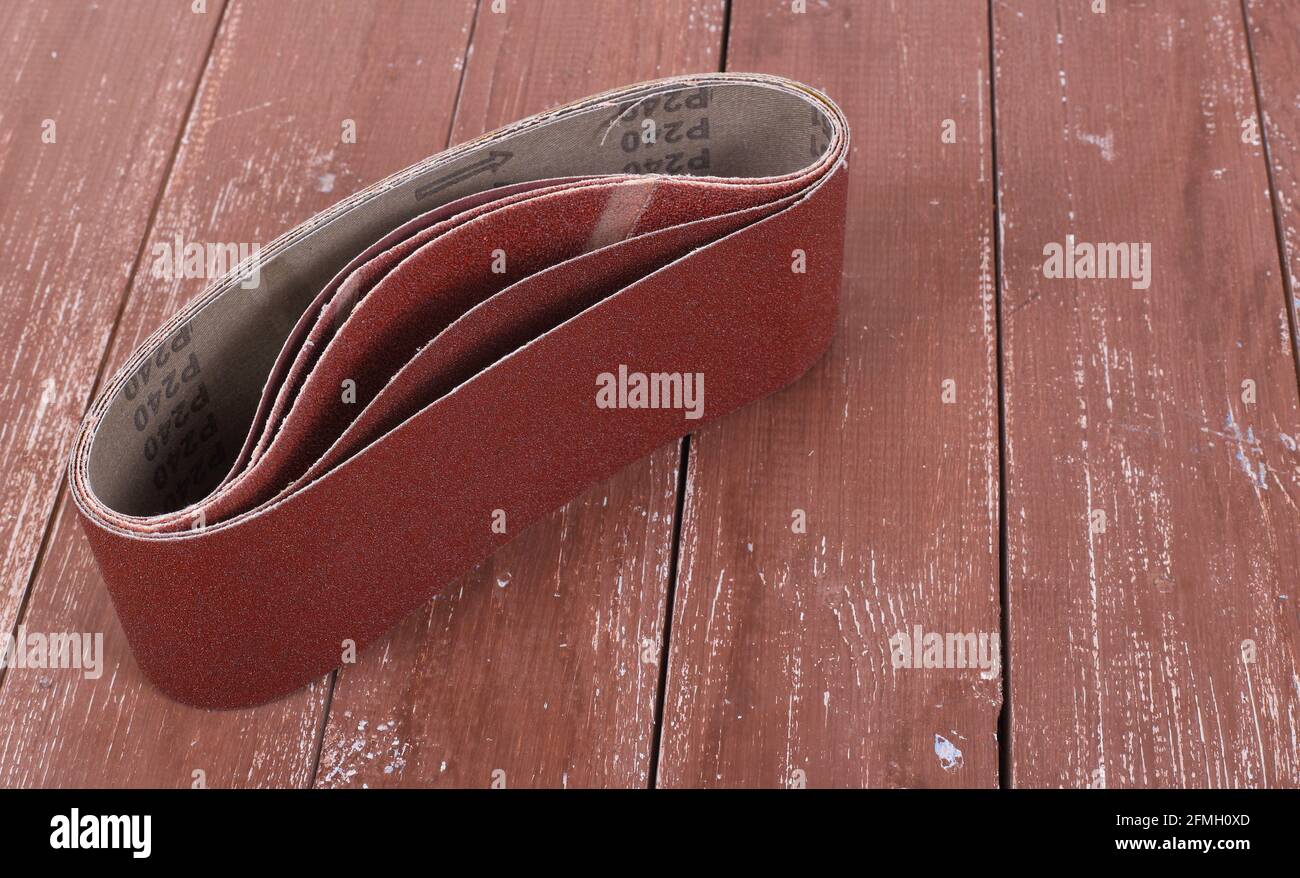 Tools Building and repair - Machine emery paper on a wooden background ...