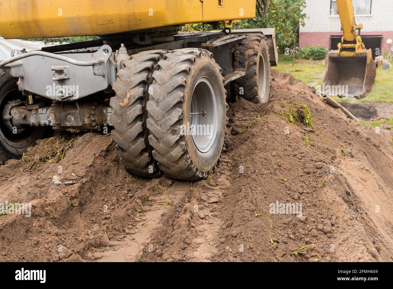 Traces from tire tread on the back of industrial transport excavator or ...