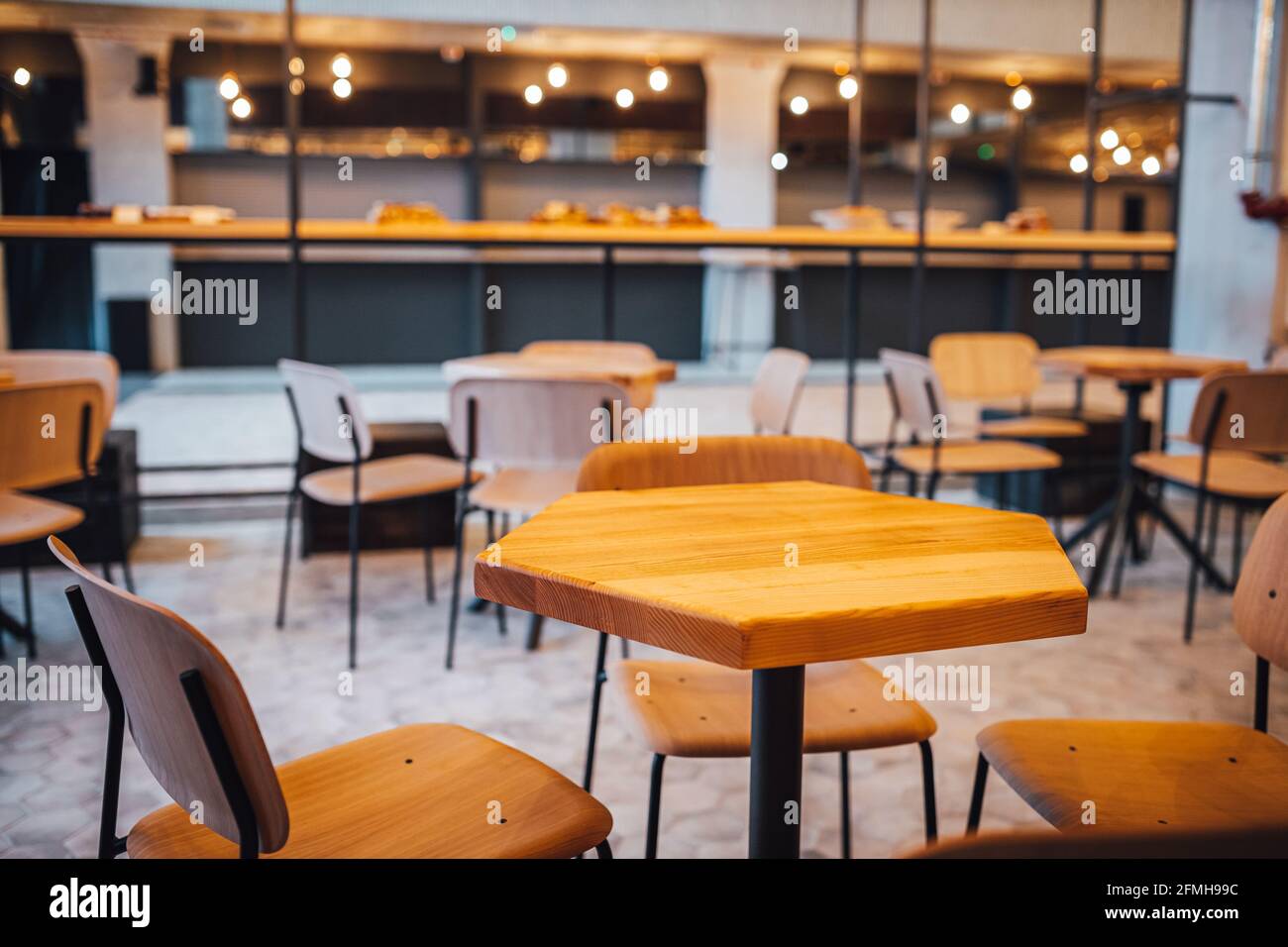A close up view of empty wooden coffee shop tables Stock Photo - Alamy