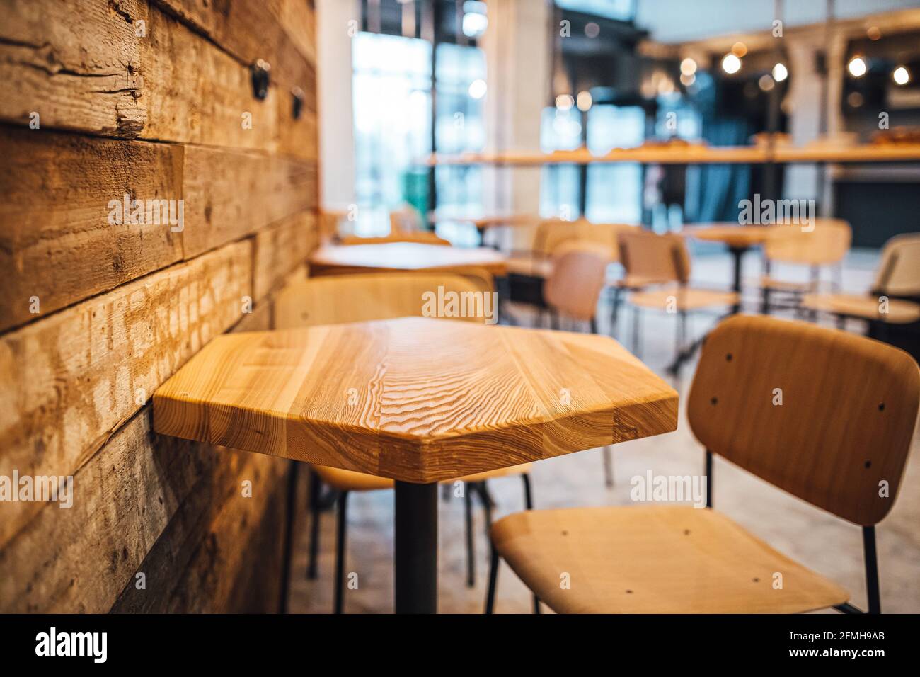 A close up view of empty wooden coffee shop tables Stock Photo - Alamy