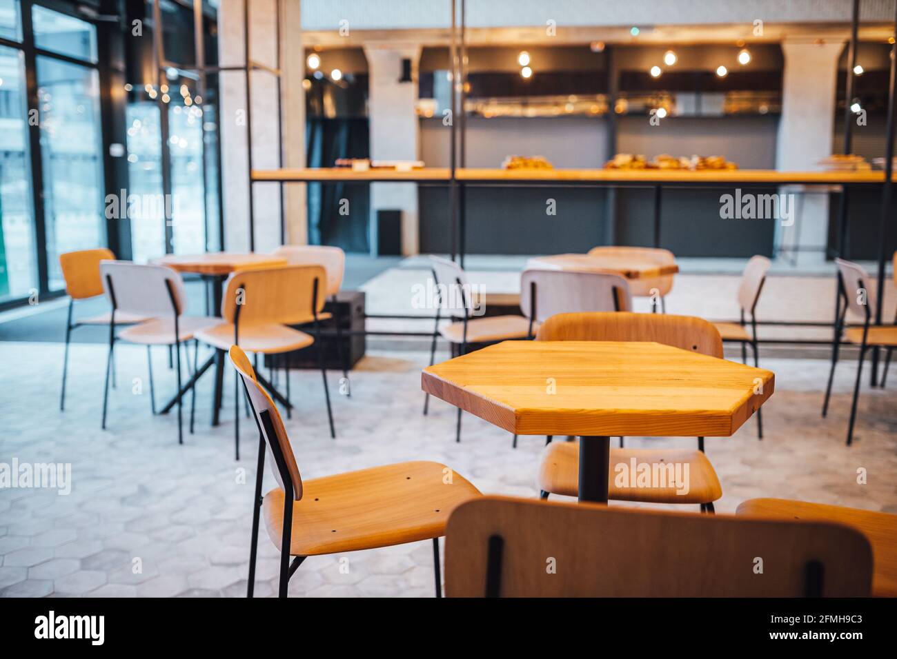 A close up view of empty wooden coffee shop tables Stock Photo - Alamy