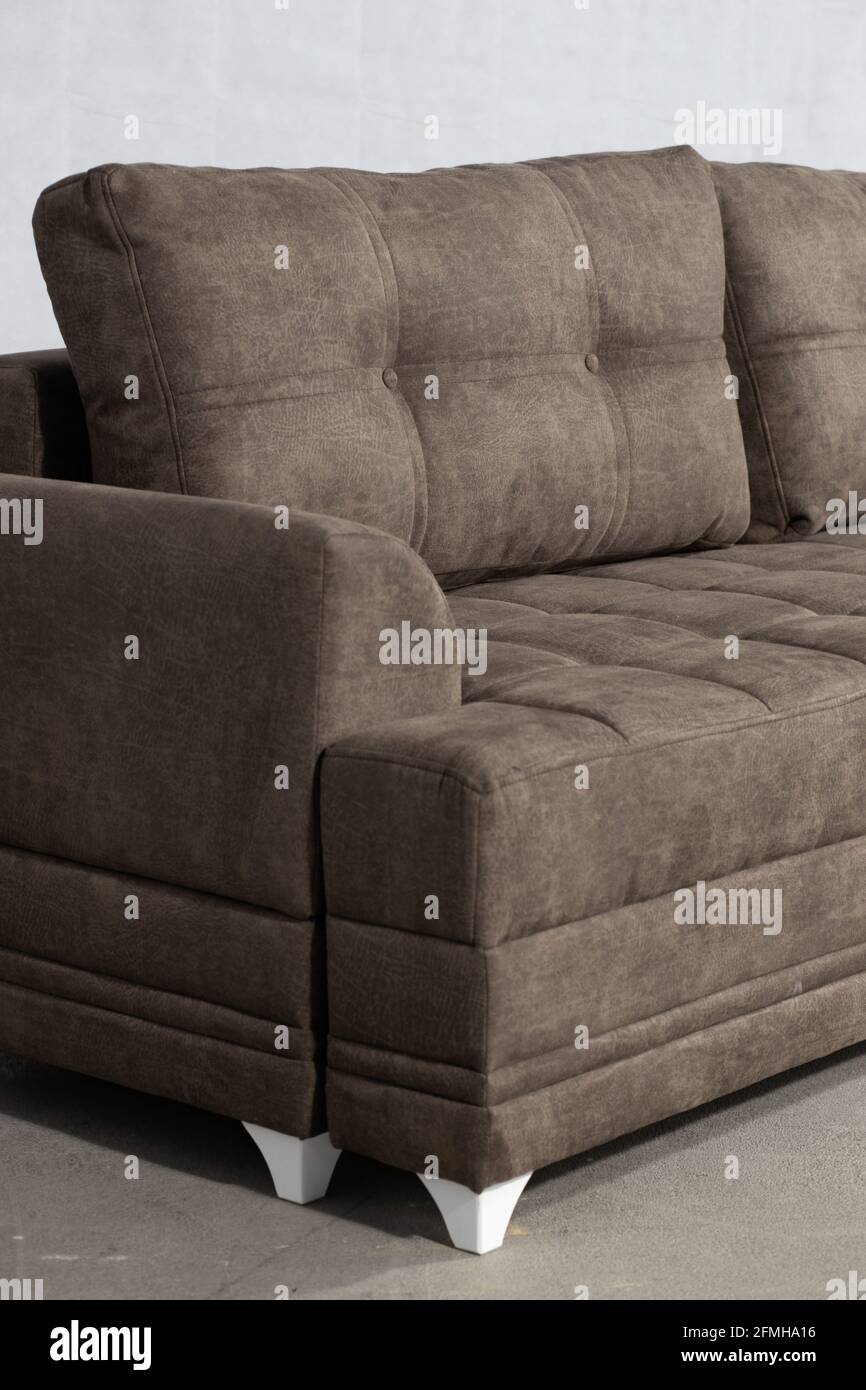 A vertical shot of a grey drape sofa Stock Photo - Alamy