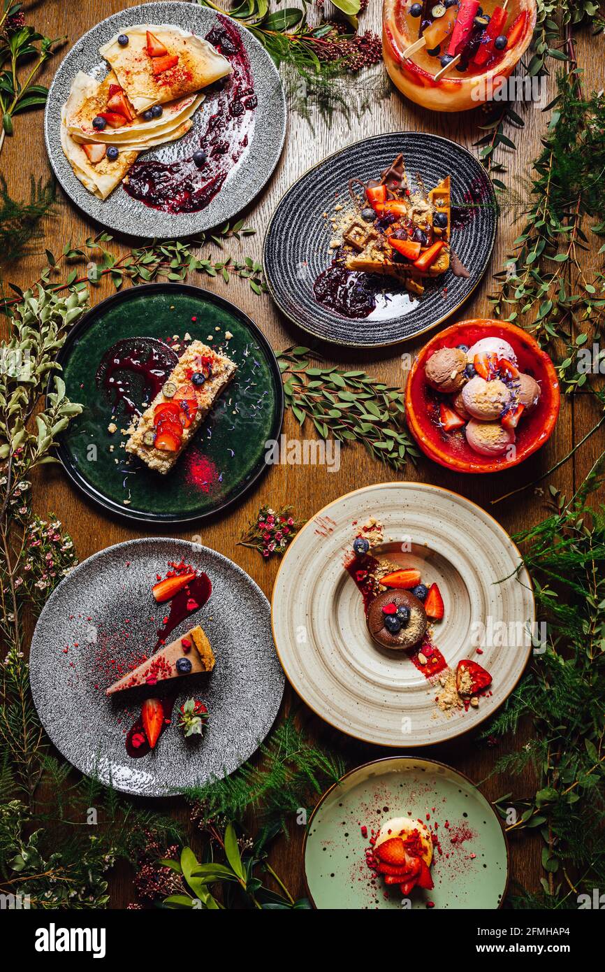 A studio shot of desserts in plates Stock Photo - Alamy