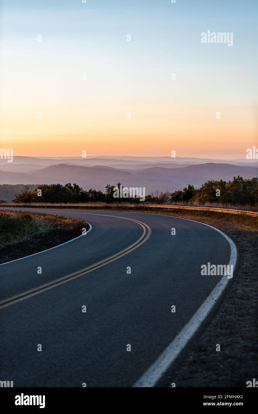 Vertical view on fall autumn season with sunrise at winding Highland ...