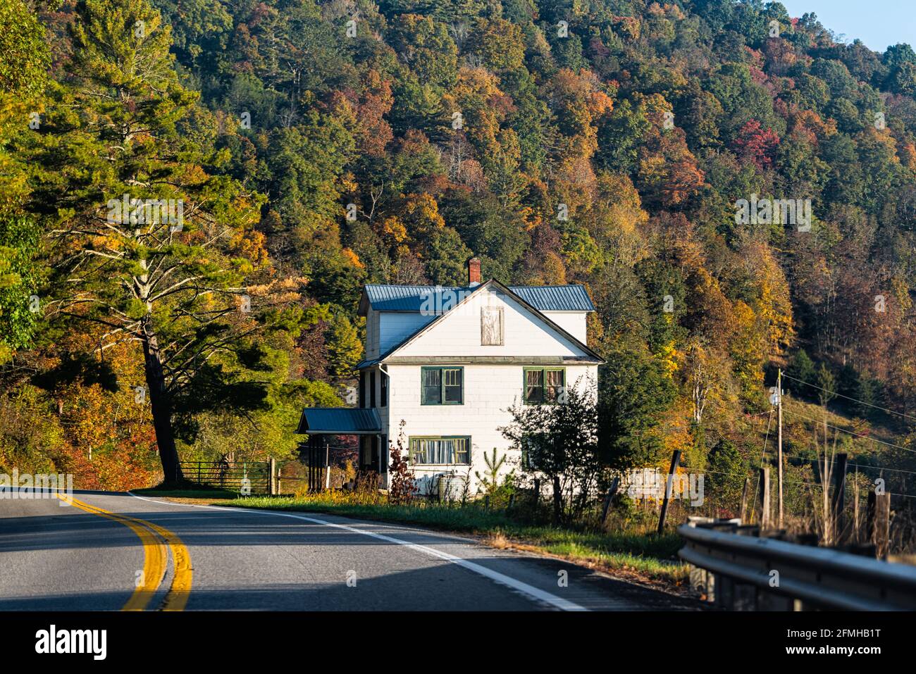 Farmhouse house by roadside in countryside rural road in West Virginia ...