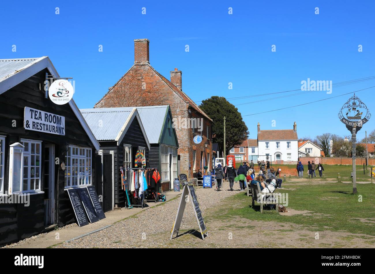 Spring sunshine on the village green in Walberswick, in Suffolk, UK ...